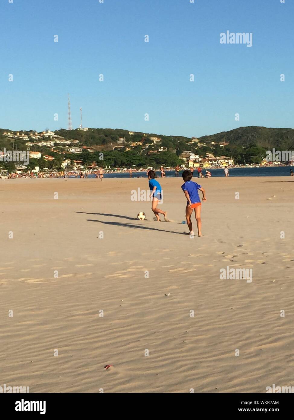 Boys playing football on beach hi-res stock photography and images - Alamy