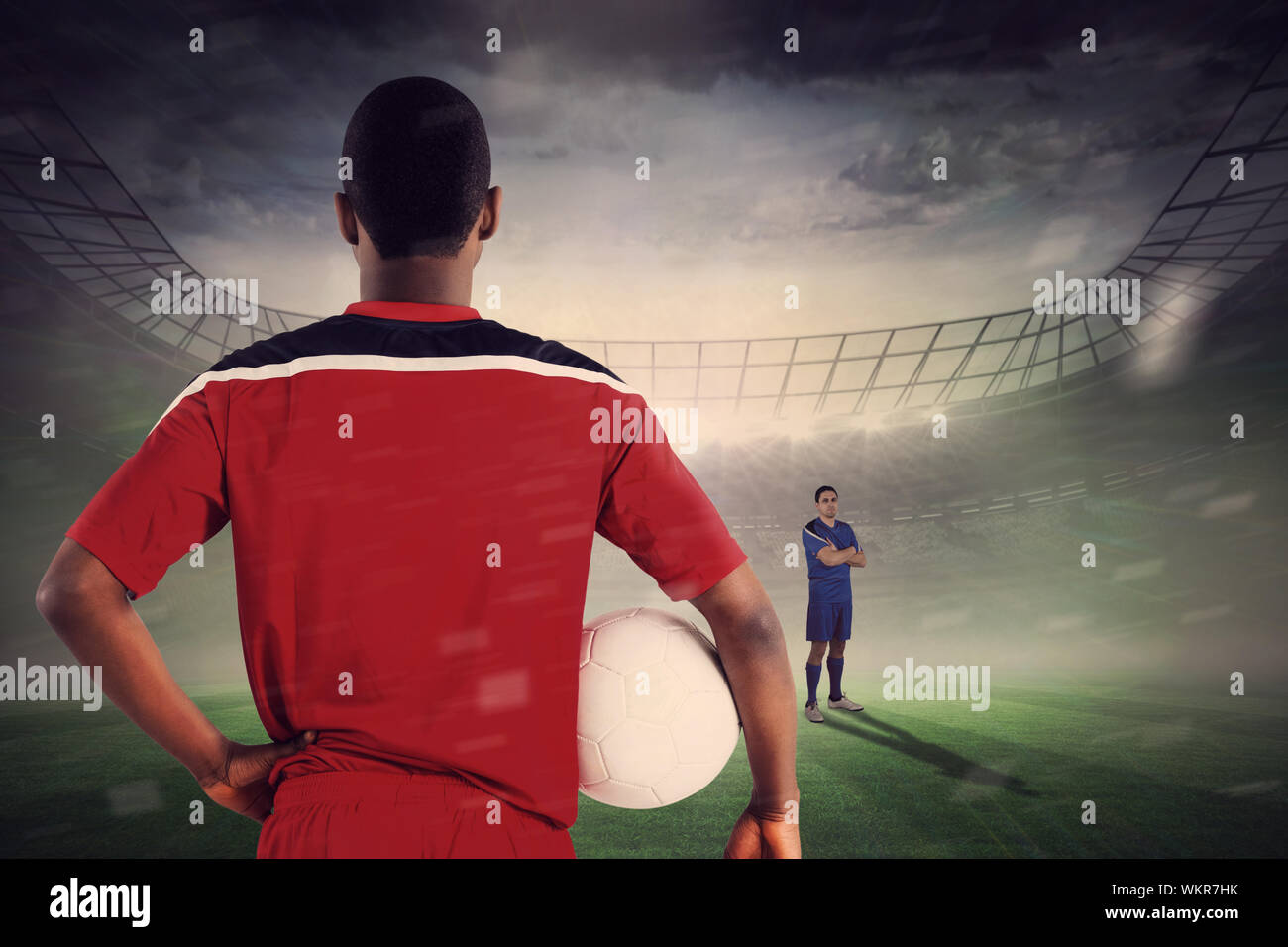 Football players facing off in large digitally generated stadium Stock ...