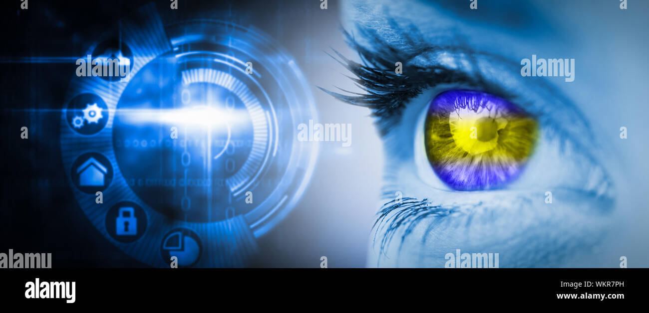 Green and yellow eye on blue face against black technology interface ...