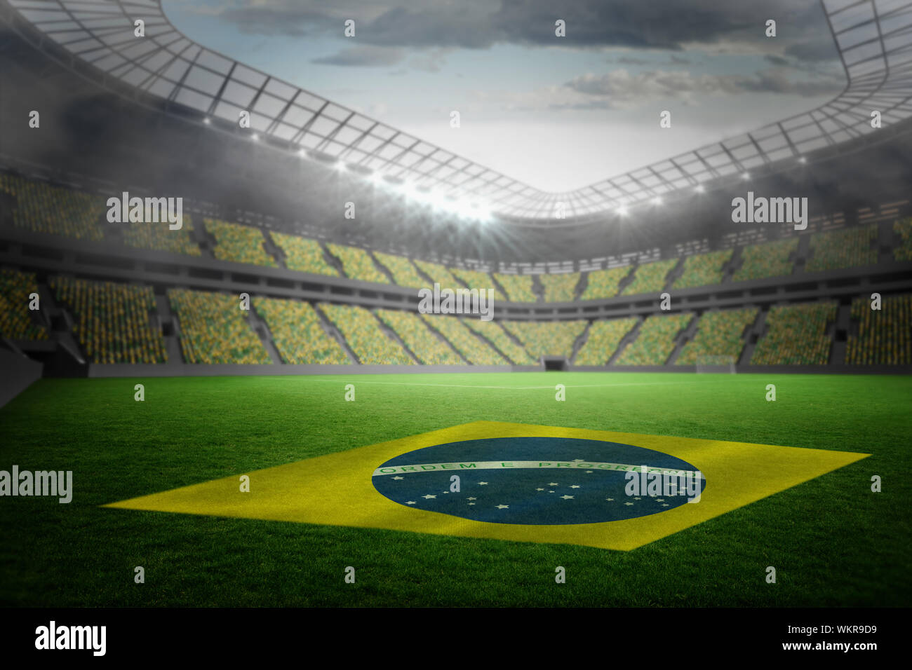 Digitally generated brazilian national flag against large football ...