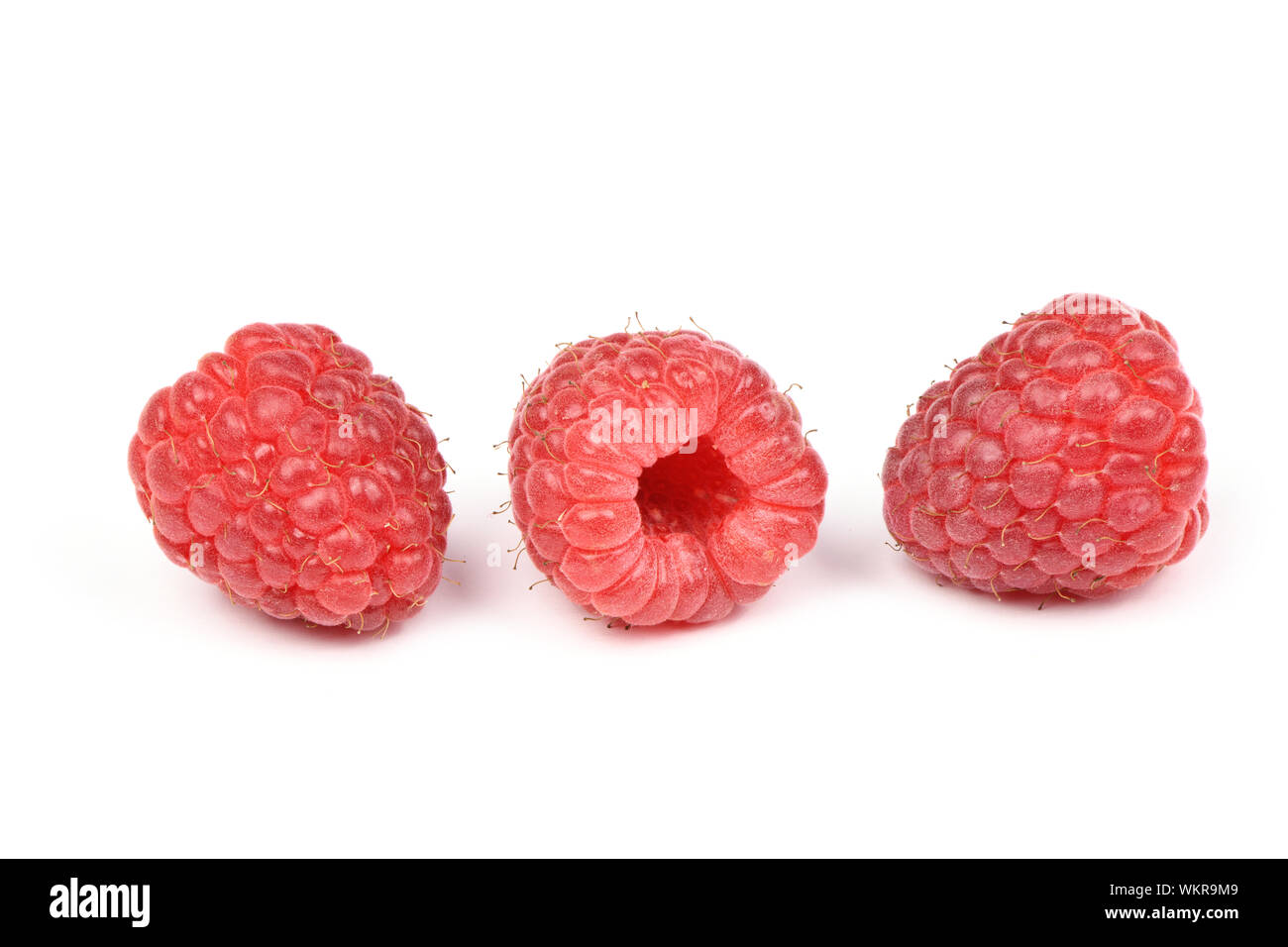 Three red raspberry berries isolated on white background. High ...