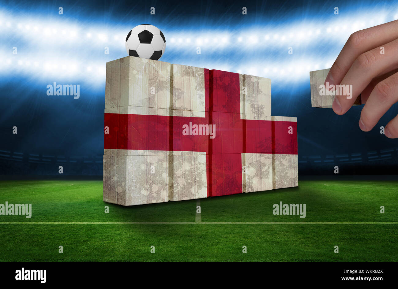 Hand building wall of england flag in grunge effect Stock Photo - Alamy
