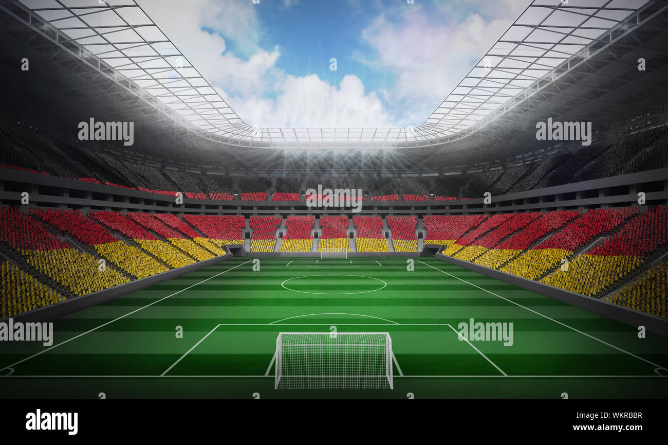 Digitally generated german national flag against football stadium Stock ...