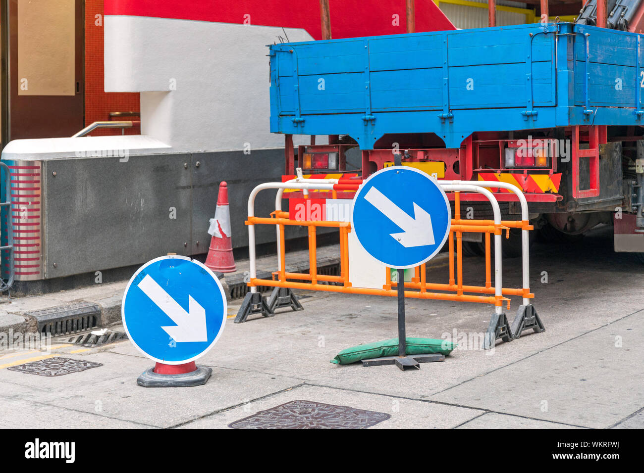 Two Blue Direction Arrows Traffic Signs Construction Stock Photo - Alamy