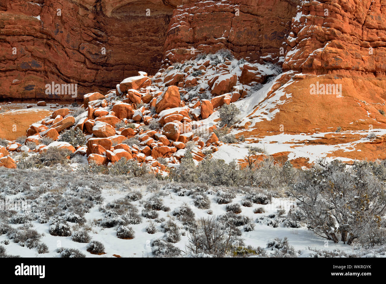 Fresh snow at the base of Entrada Sandstone pillars, Arches National ...