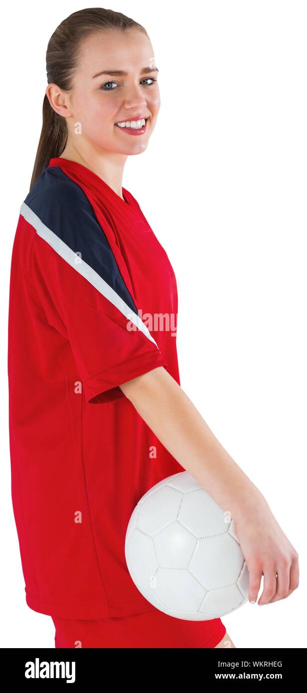 Cute football player standing with ball on white background Stock Photo ...