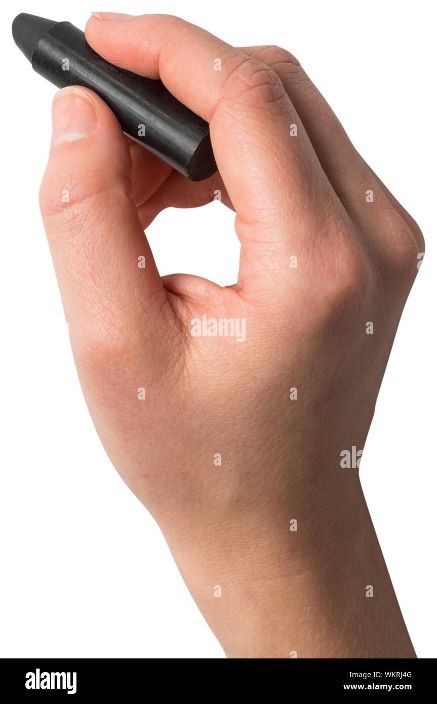 Hand holding black crayon on white background Stock Photo - Alamy