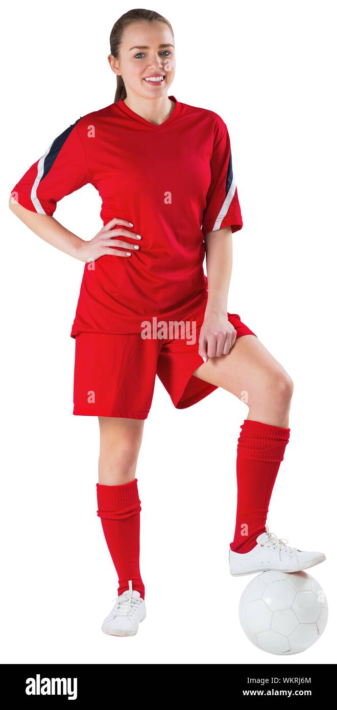 Cute football player standing with ball on white background Stock Photo ...