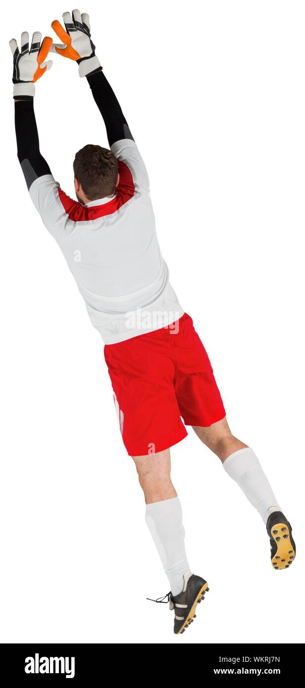 Goalkeeper in white jumping up on white background Stock Photo - Alamy