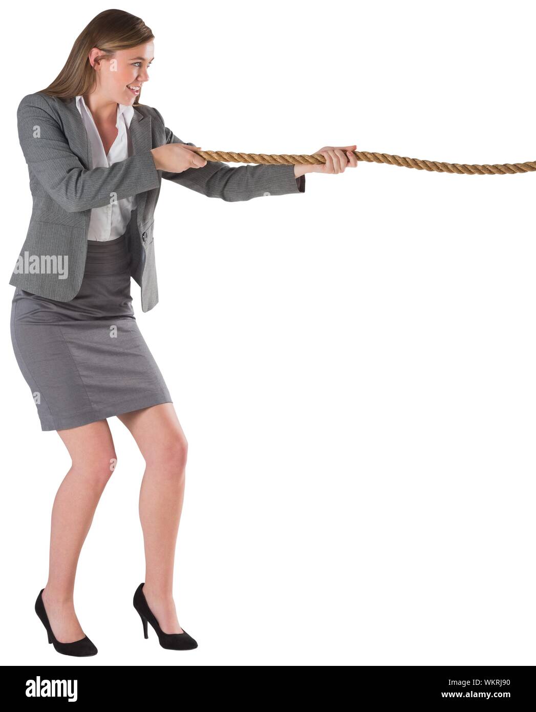 Smiling woman pulling rope on hi-res stock photography and images - Alamy