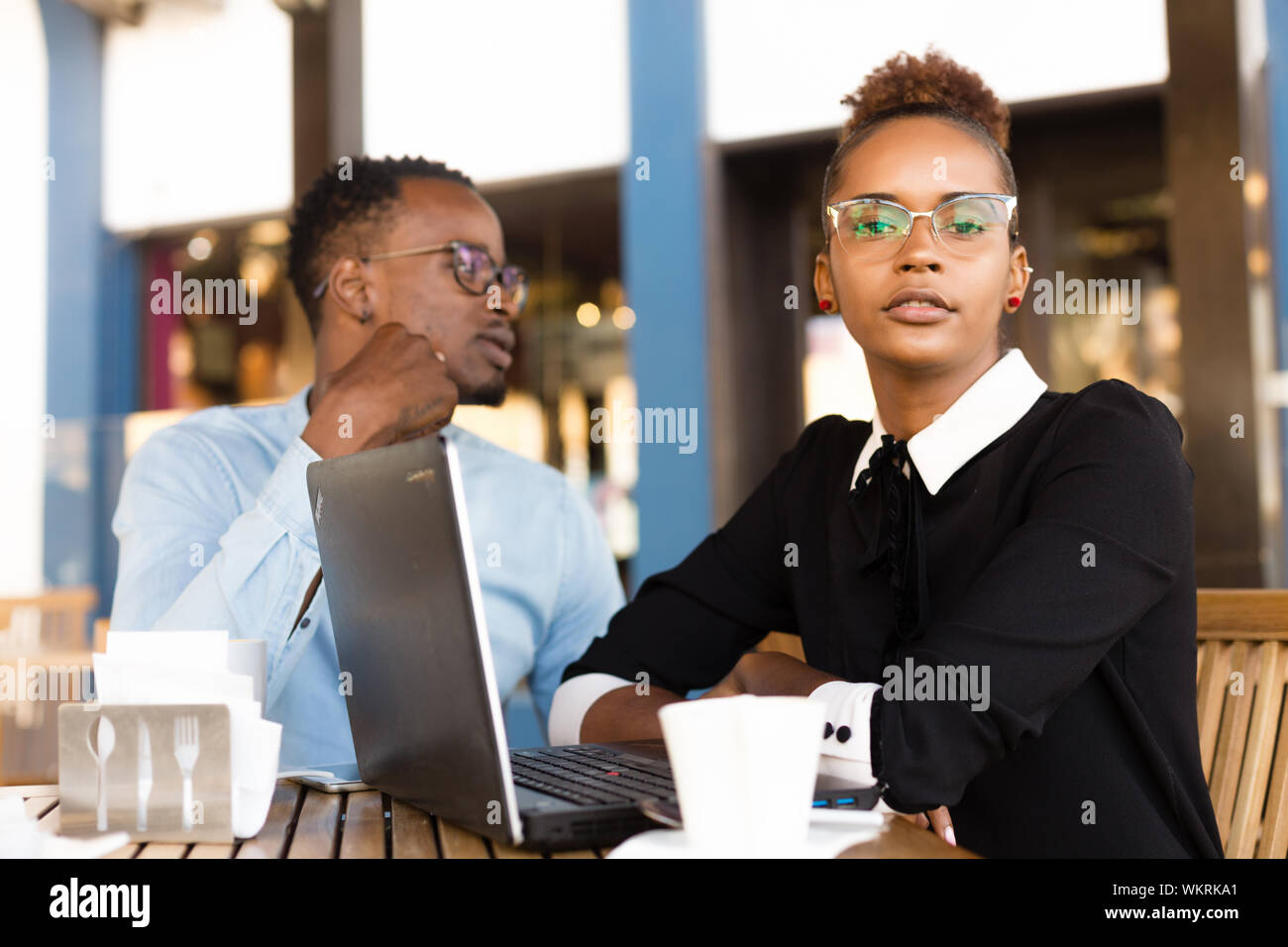 Black African American coworkers doing digital teamwork arround a ...