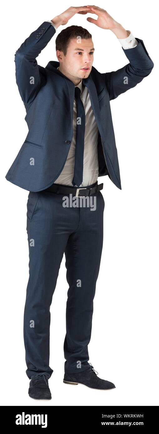 Businessman standing with hands over head on white background Stock ...