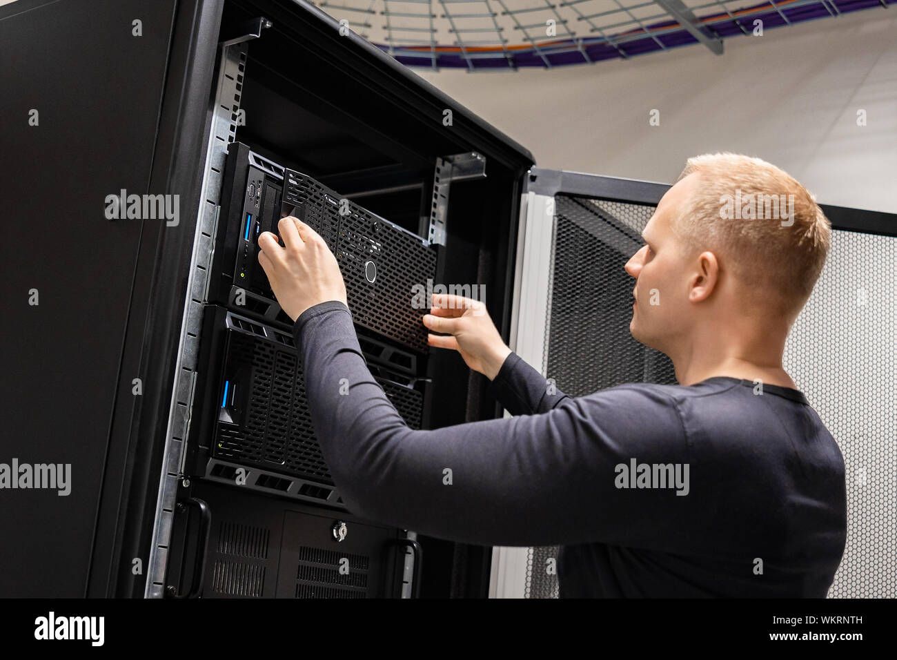 Standing working illuminated technology hi-res stock photography and ...