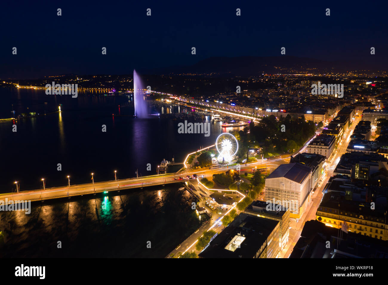 Aerial night view of Geneva city waterfront skyline in Switzerland ...
