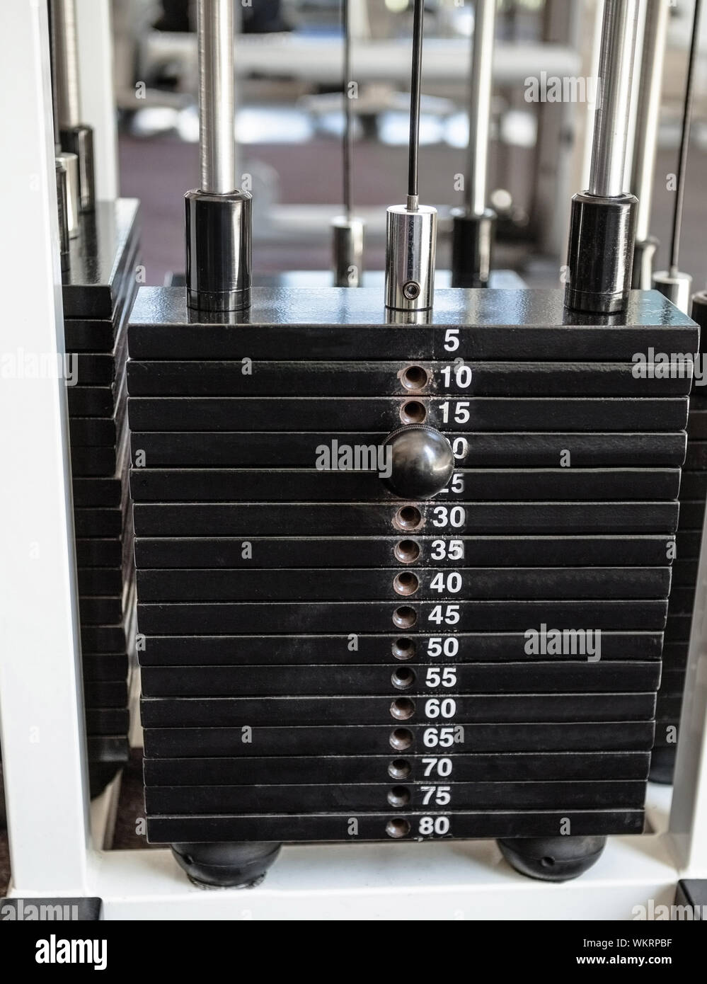 Heavy weights on the weight machine at the gym Stock Photo - Alamy