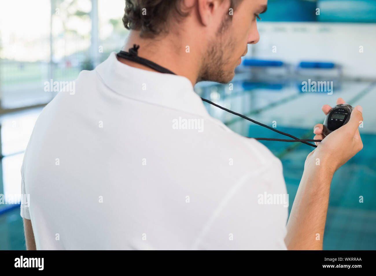 Swimming coach looking stopwatch pool hi-res stock photography and ...