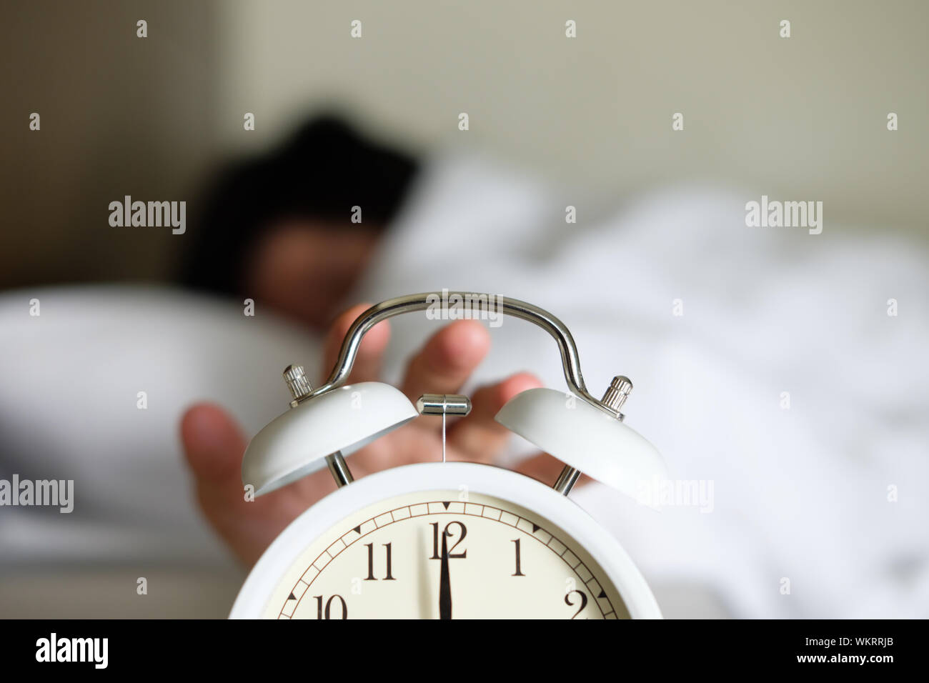 Hand turning off alarm clock hi-res stock photography and images - Alamy