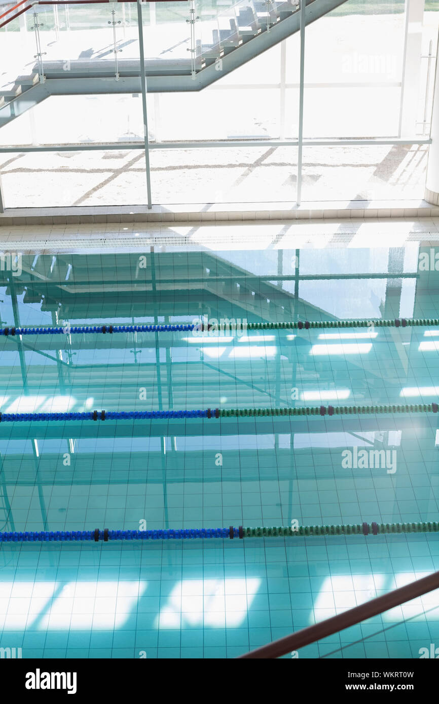 Large swimming pool with sunlight streaming in at the leisure center ...