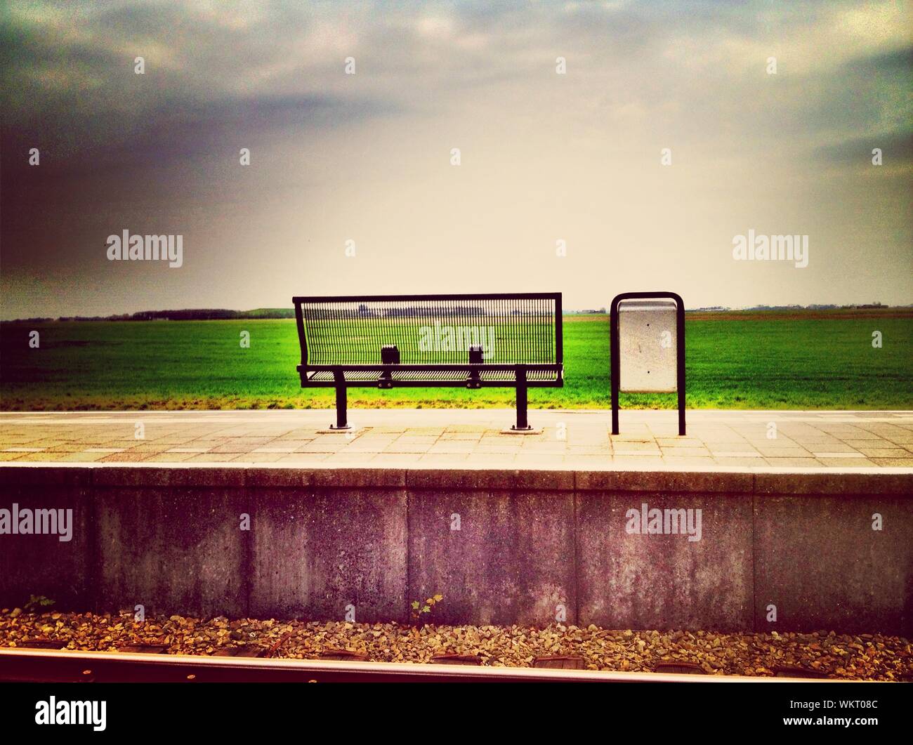 Empty railroad station platform bench hi-res stock photography and ...