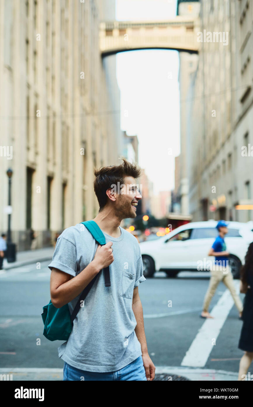 Young man walking the city hi-res stock photography and images - Alamy