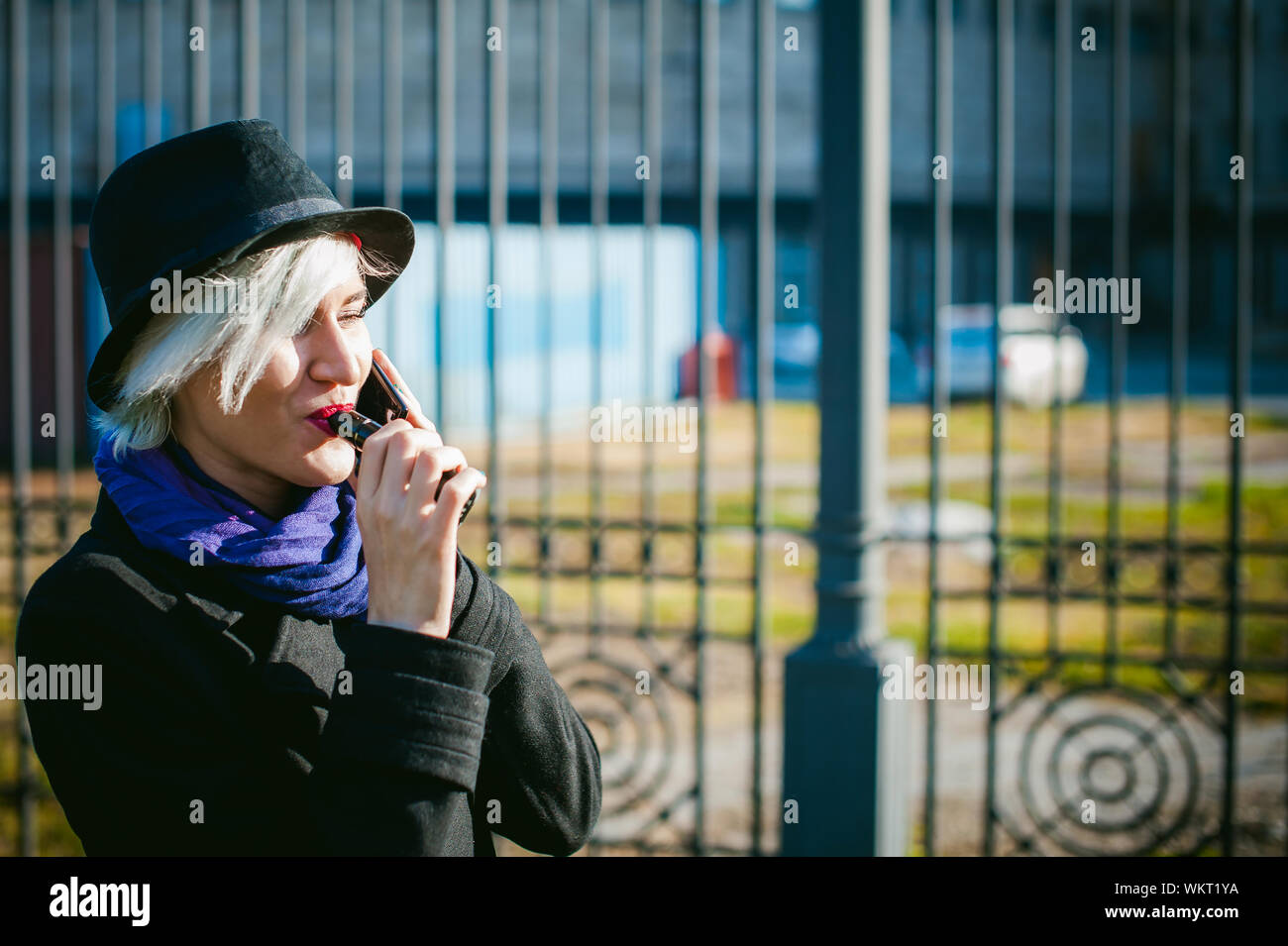 Woman smoking on phone hi-res stock photography and images - Alamy