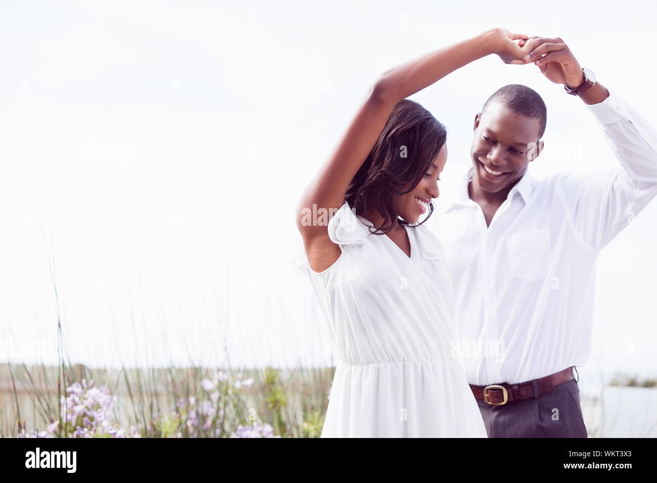 Romantic couple dancing and smiling outside in the garden Stock Photo ...