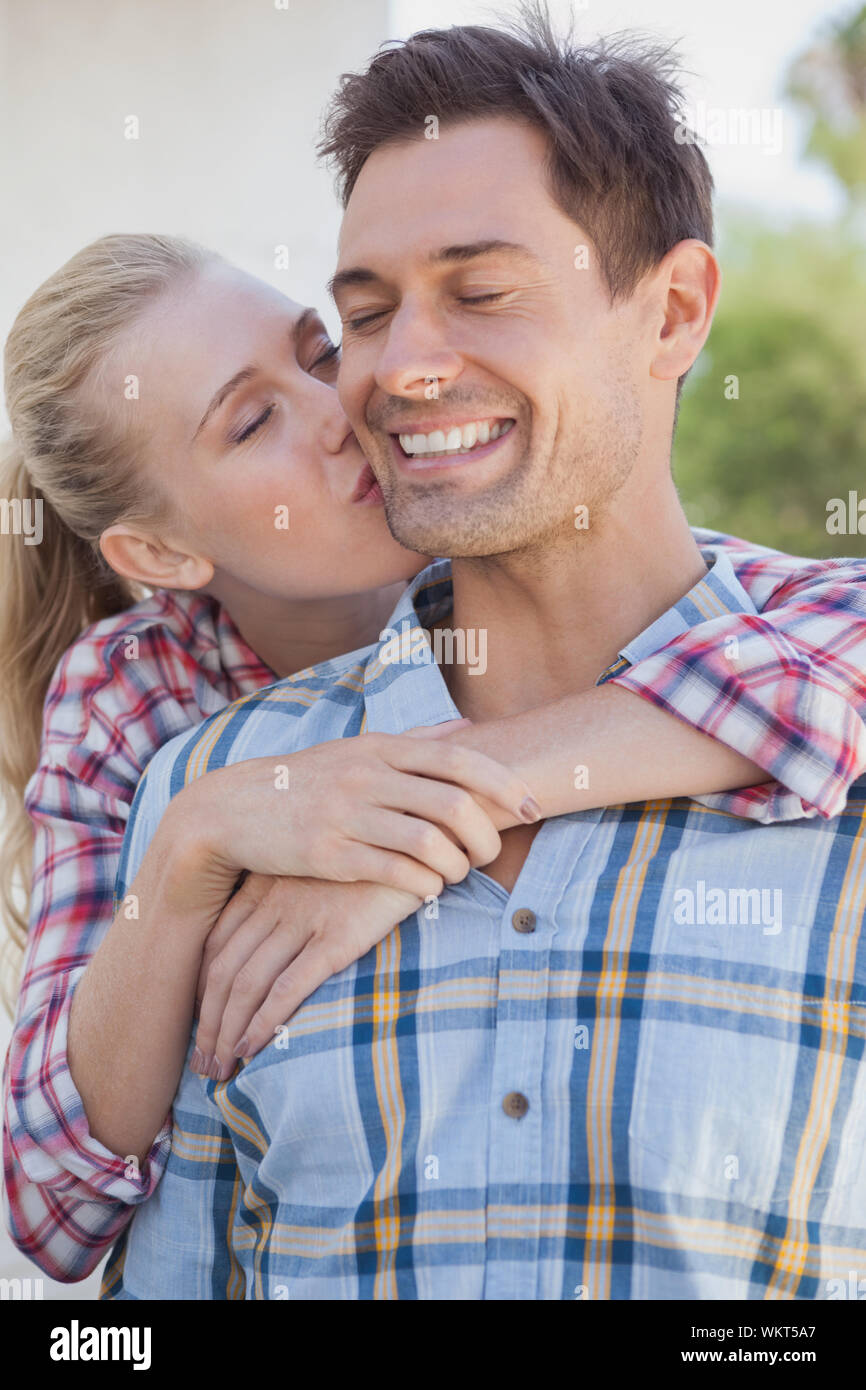 Woman kissing man in check hi-res stock photography and images - Alamy