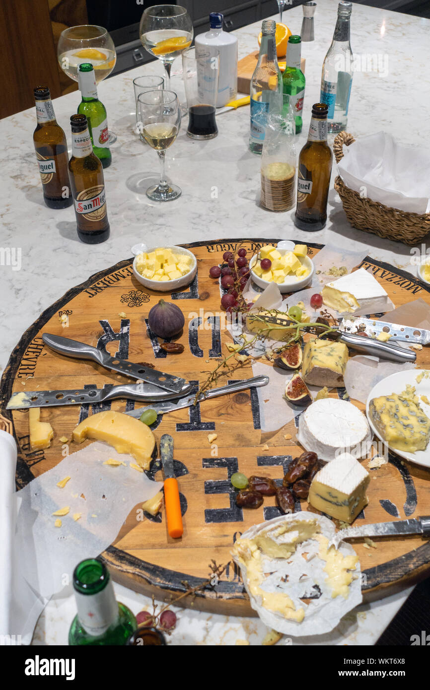 Left over drink and cheese after a party Stock Photo - Alamy