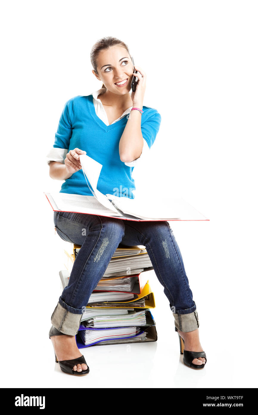 Beautiful female student making a phone call isolated on white Stock ...