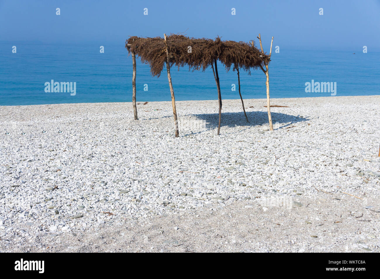 Straw canopy on the beach. Borsh Albania Stock Photo - Alamy
