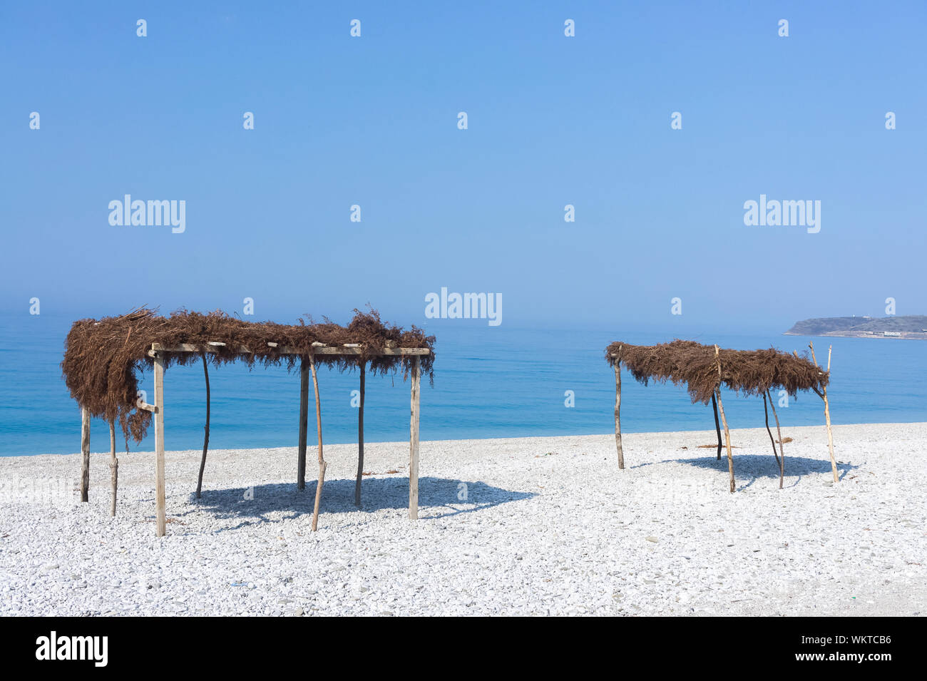 Straw canopy on the beach. Borsh Albania Stock Photo - Alamy