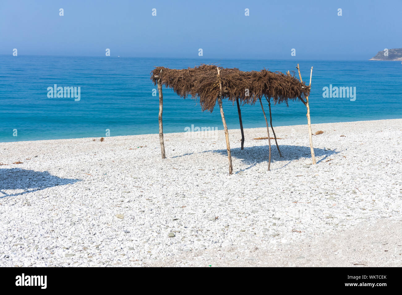 Straw canopy on the beach. Borsh Albania Stock Photo - Alamy