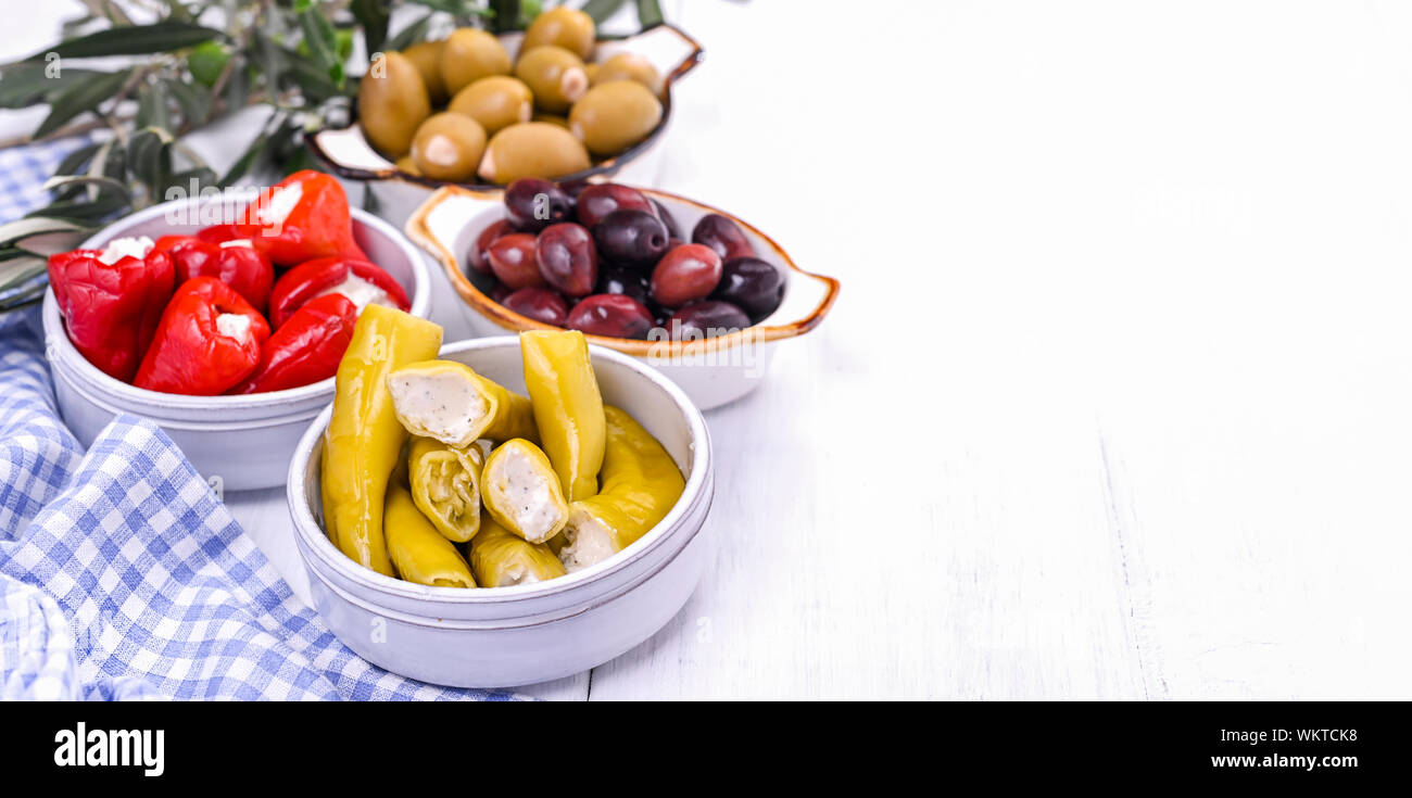 Traditional appetizers, green and red olives from Greek cuisine. Fresh ...