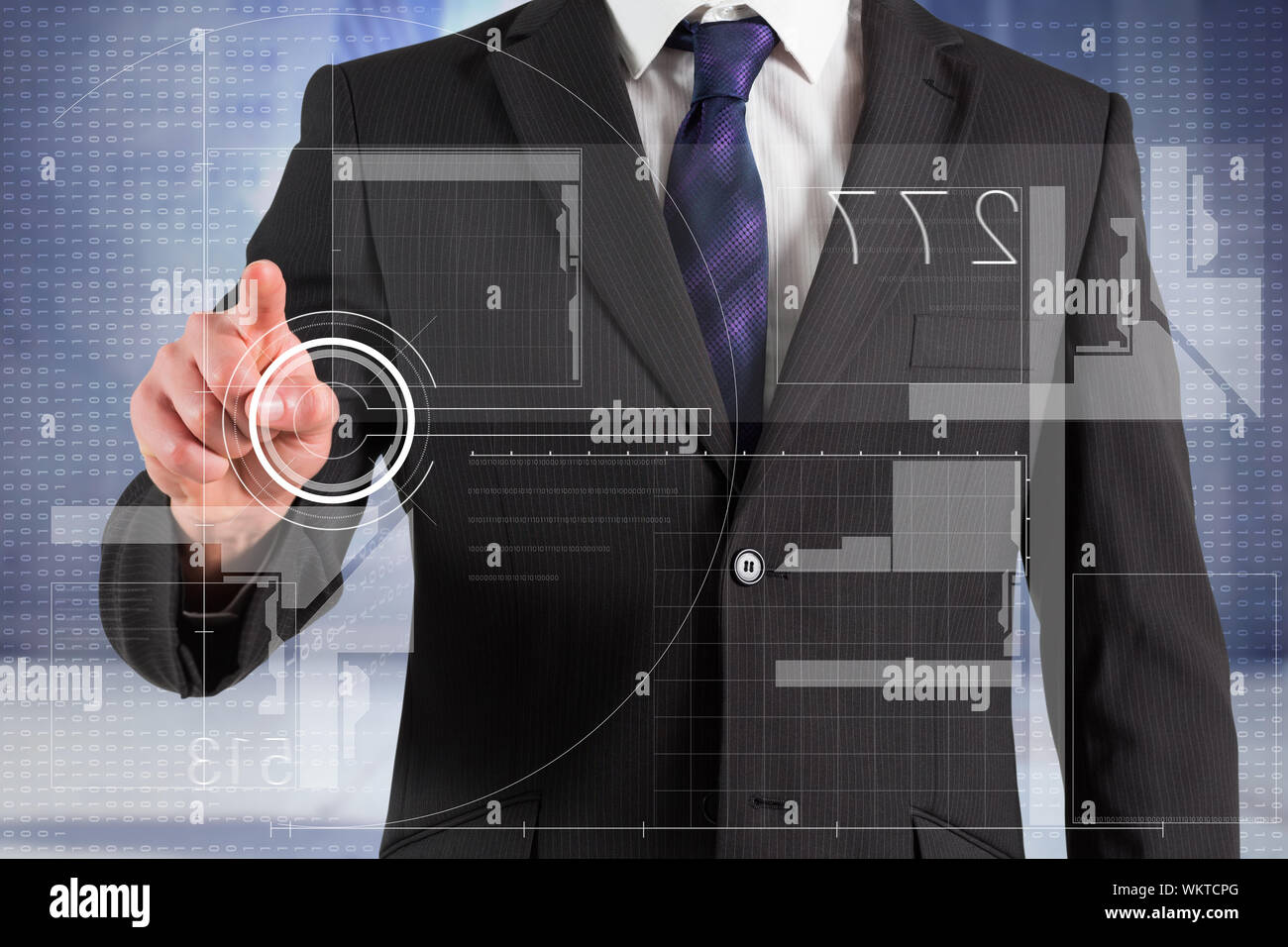 Businessman in suit pointing finger at interface against urban ...