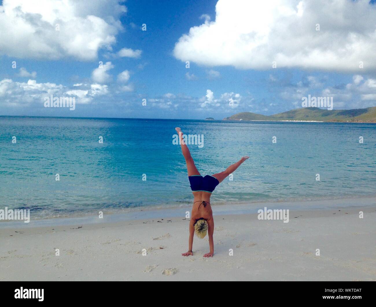 Doing handstand in sea hi-res stock photography and images - Alamy