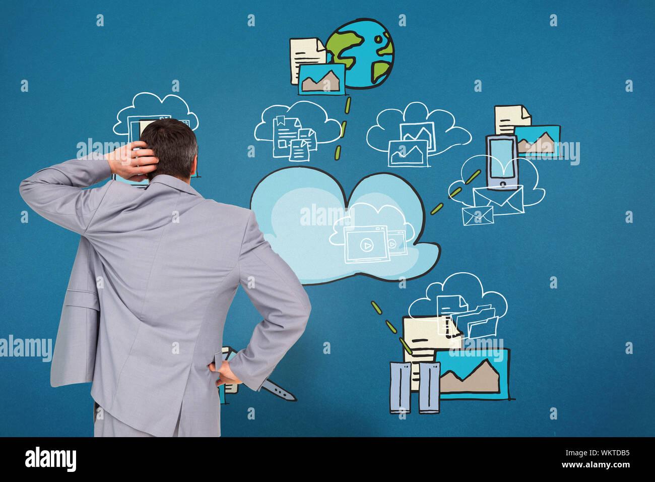 Thinking businessman against cloud computing doodle Stock Photo - Alamy