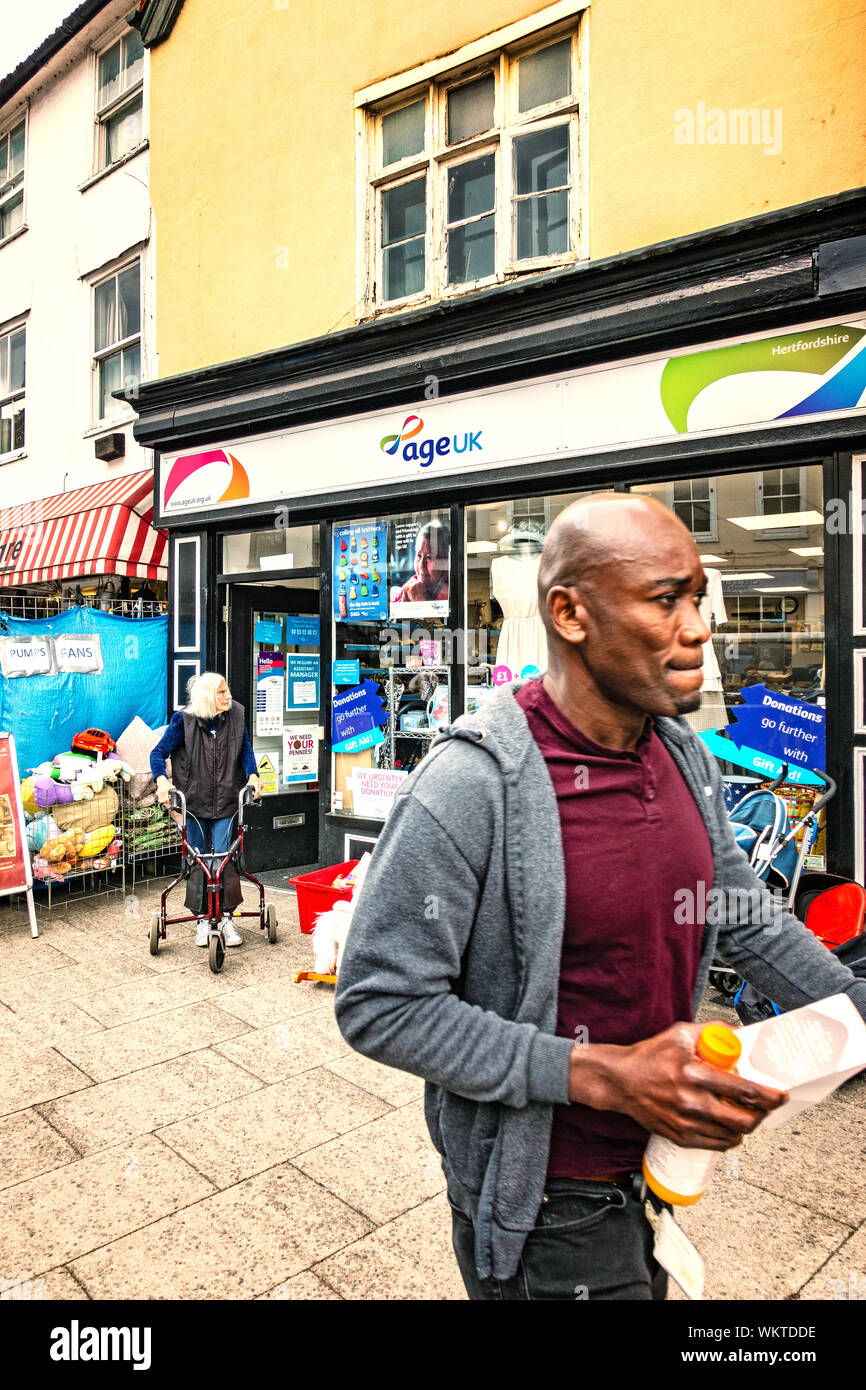 Man Walking Past Traditional Architecture High Resolution Stock ...