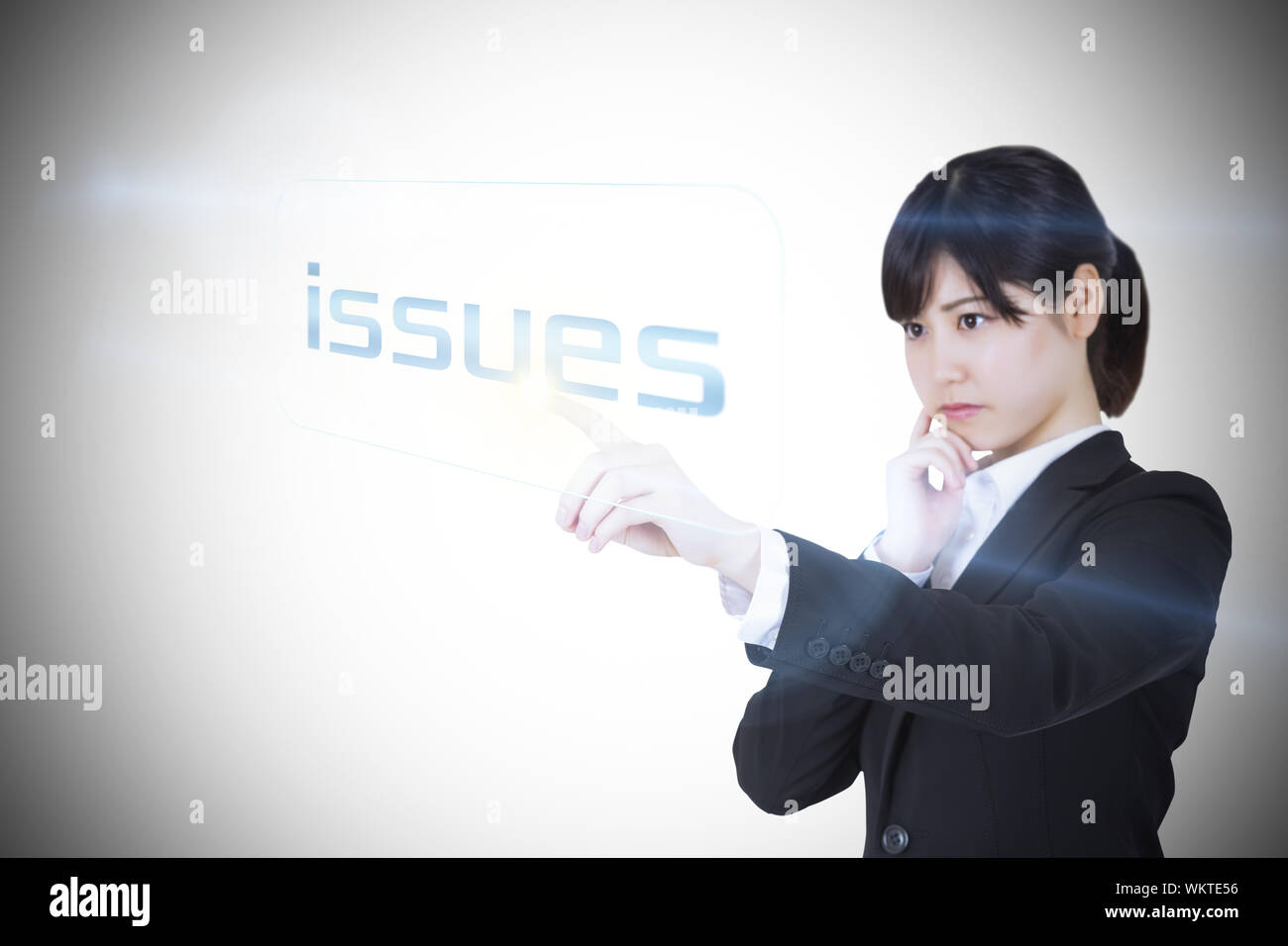 Businesswoman pointing to word issues against white background with ...