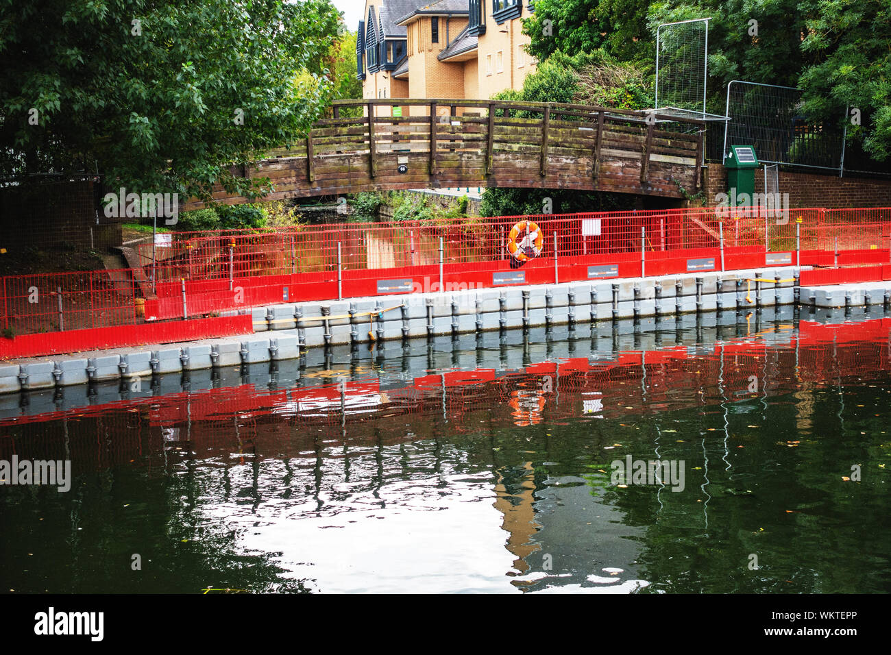 Temporary floating river footpath bridge next to damaged bridge on ...