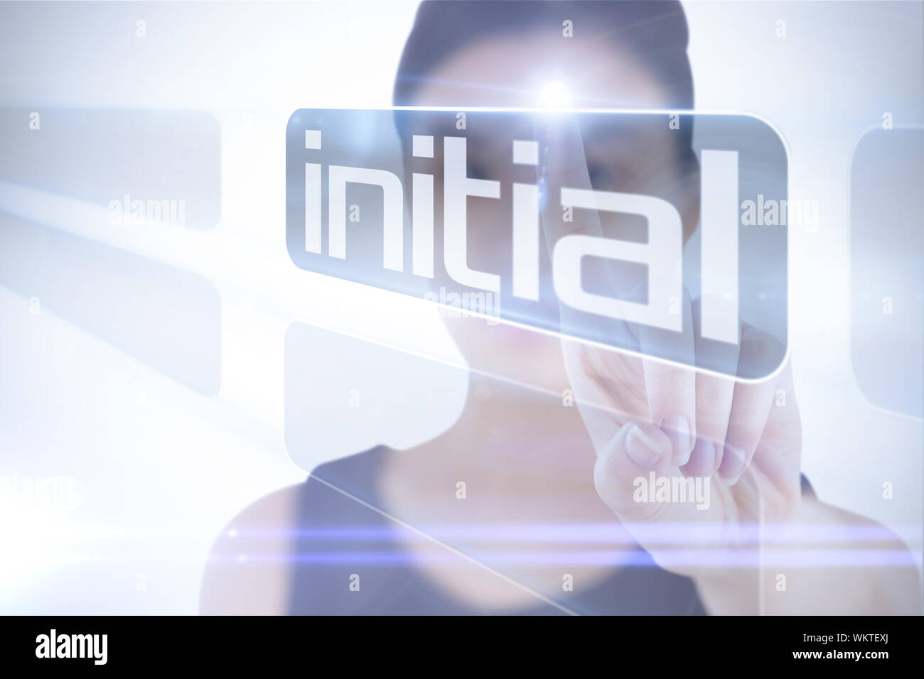 Businesswoman pointing to word initial against white background with ...