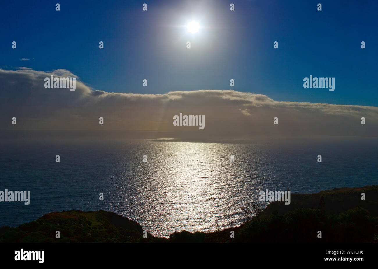 Sunshine reflecting through clouds onto the ocean Stock Photo - Alamy