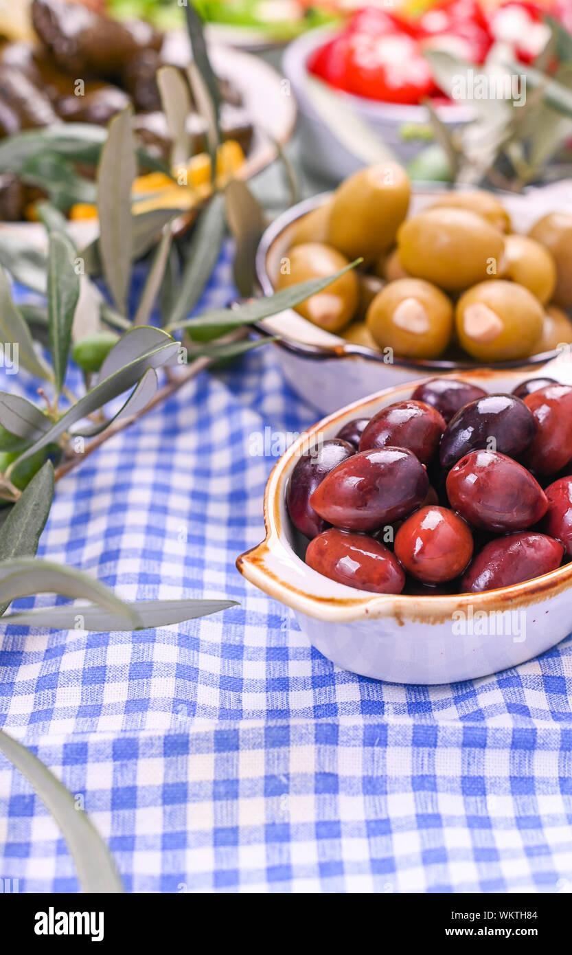 Traditional appetizers, green and red olives from Greek cuisine. Fresh ...