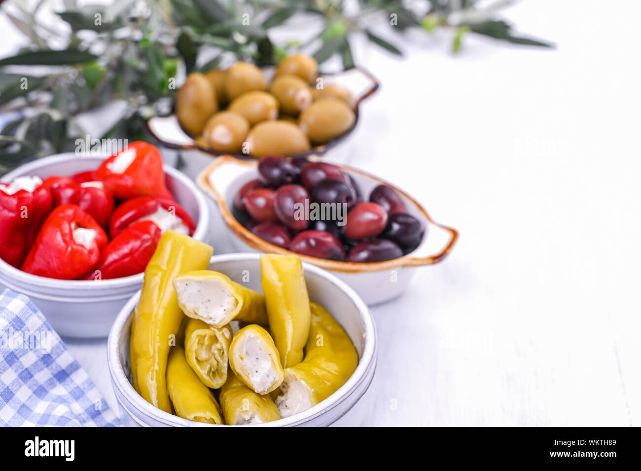 Traditional appetizers, green and red olives from Greek cuisine. Fresh ...