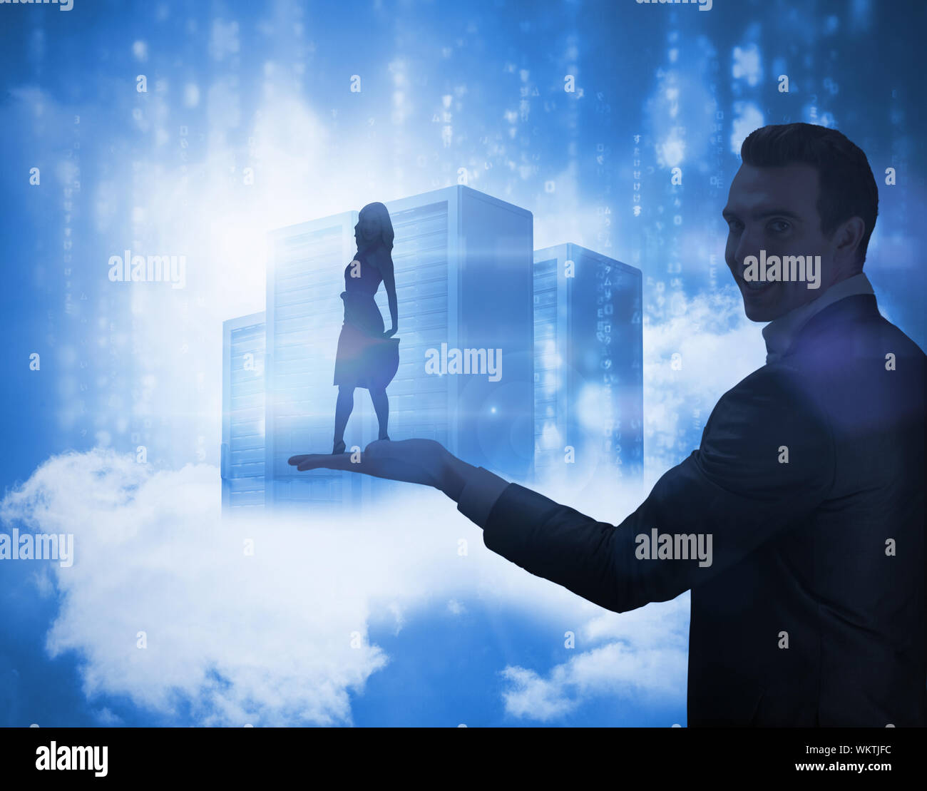 Smiling blonde turning against data servers held by giant businessman ...