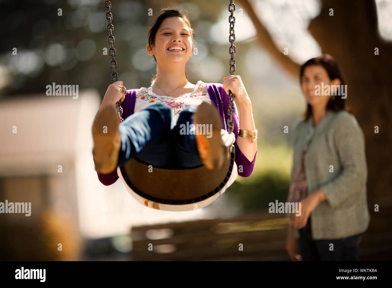 Child pushed on swing hi-res stock photography and images - Alamy