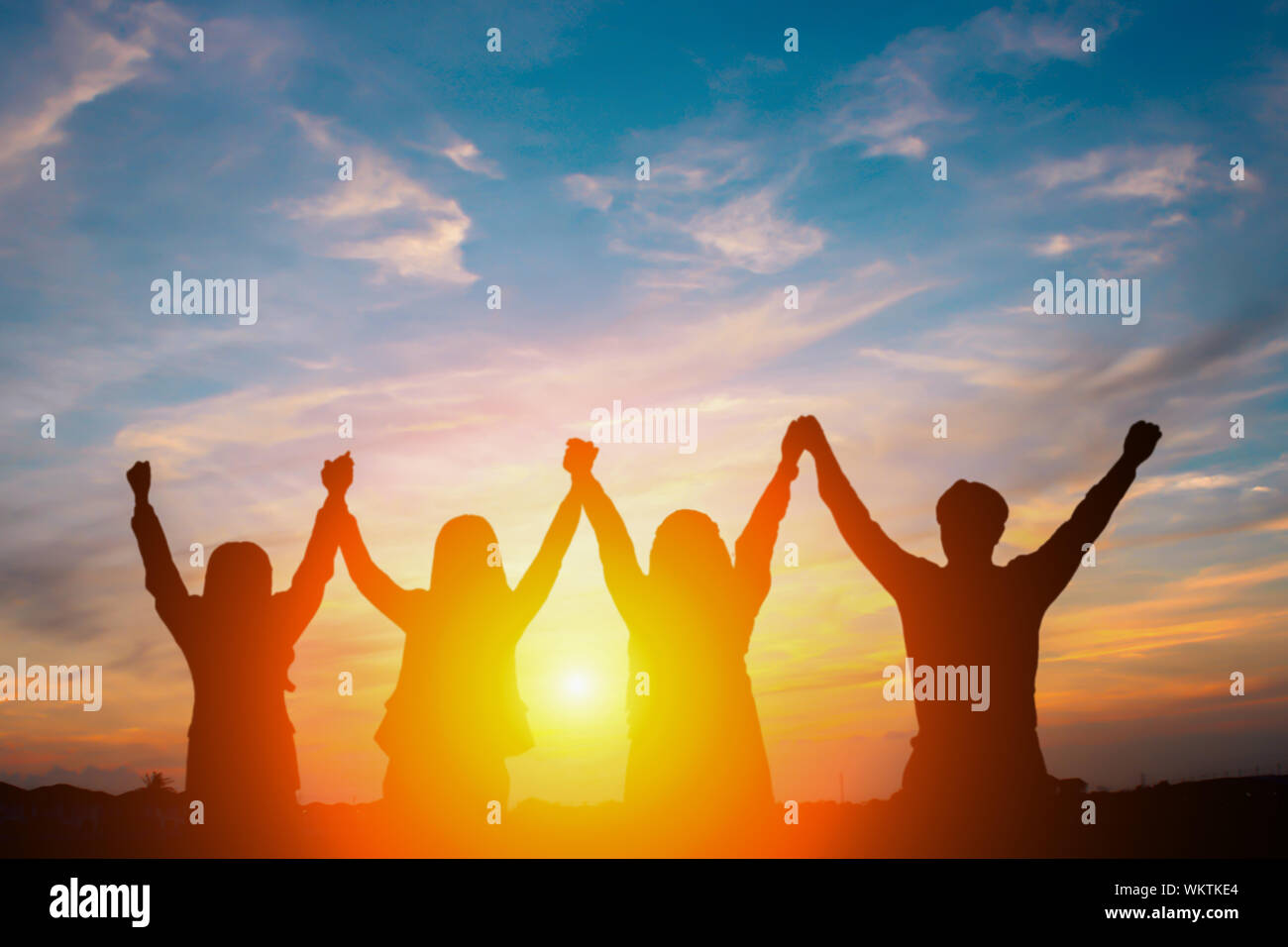 Two friends interlocked arms silhouette - supplierter