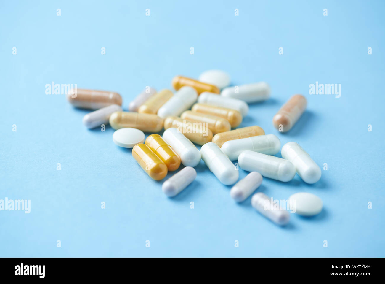 Vitamins and supplements on bright paper background. Concept for a ...