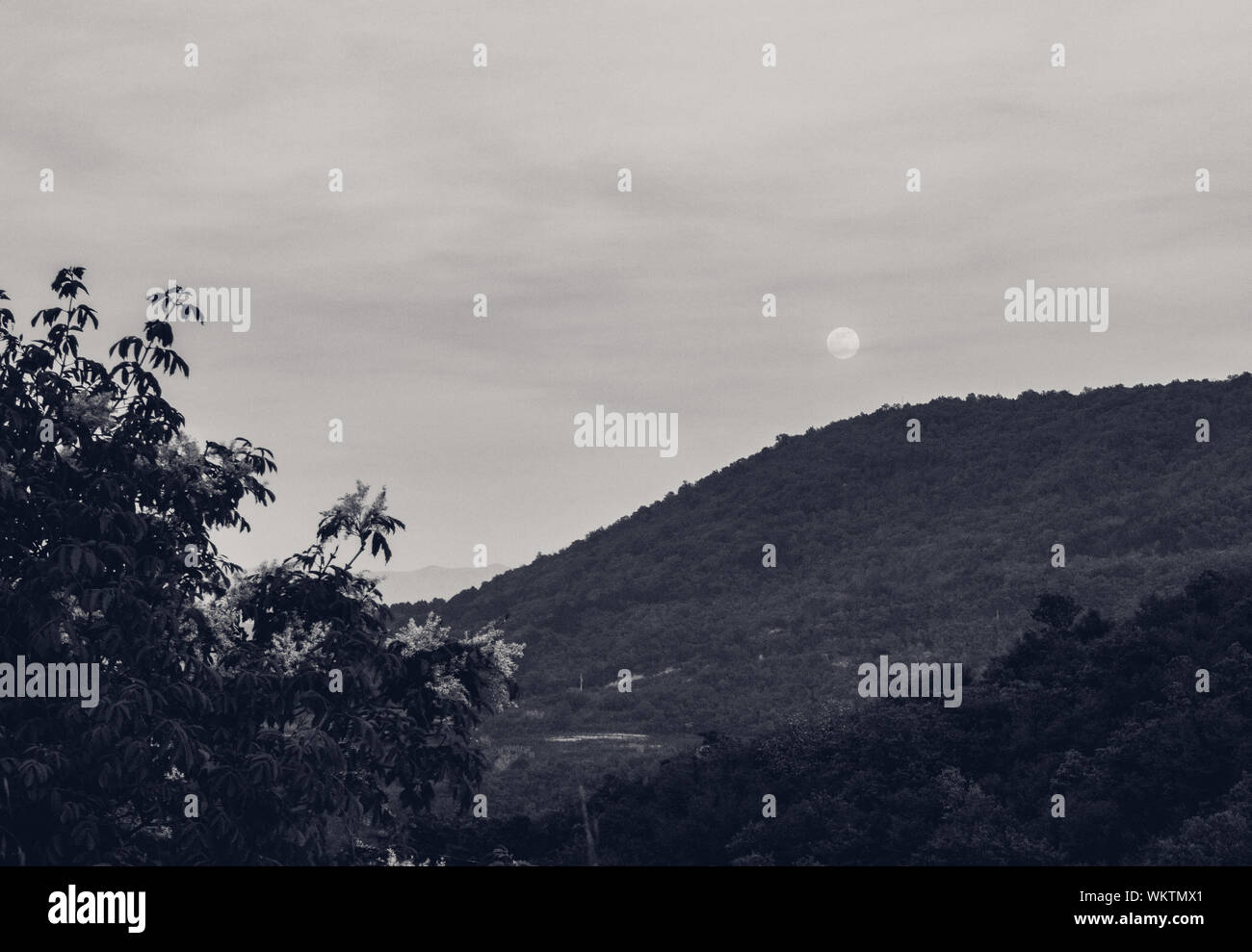 Moon over hill hi-res stock photography and images - Alamy