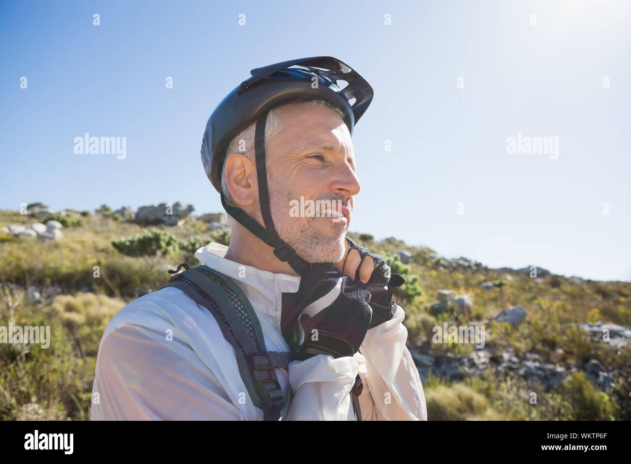 Adjusting helmet hi-res stock photography and images - Alamy