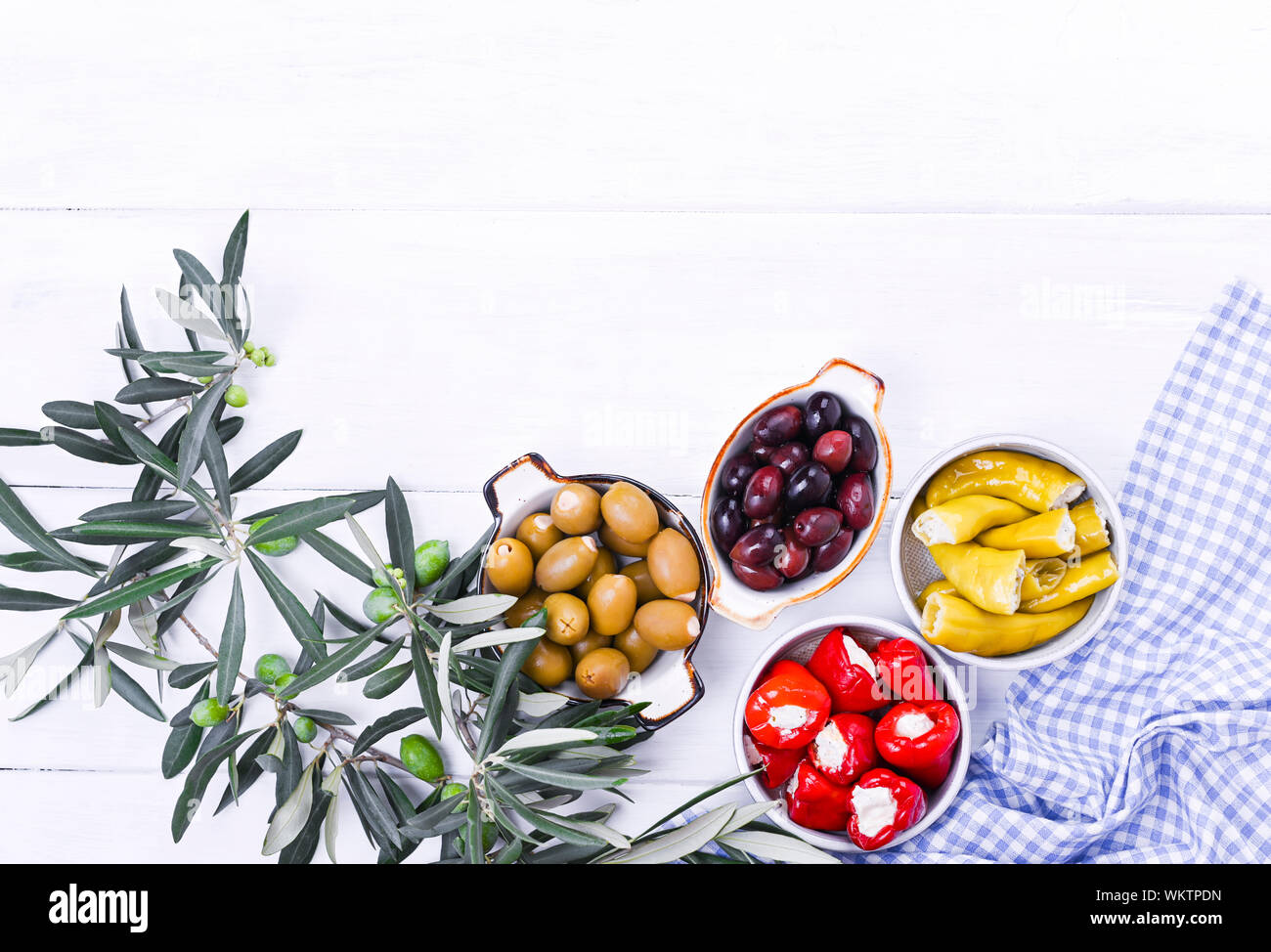 Traditional appetizers, green and red olives from Greek cuisine. Fresh ...